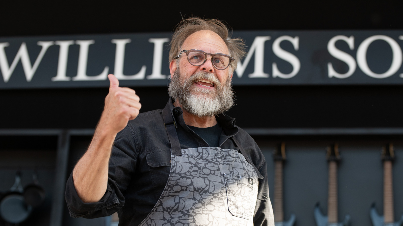 Alton Brown's Indulgent Method For Making Burgers Has Our Mouths Watering