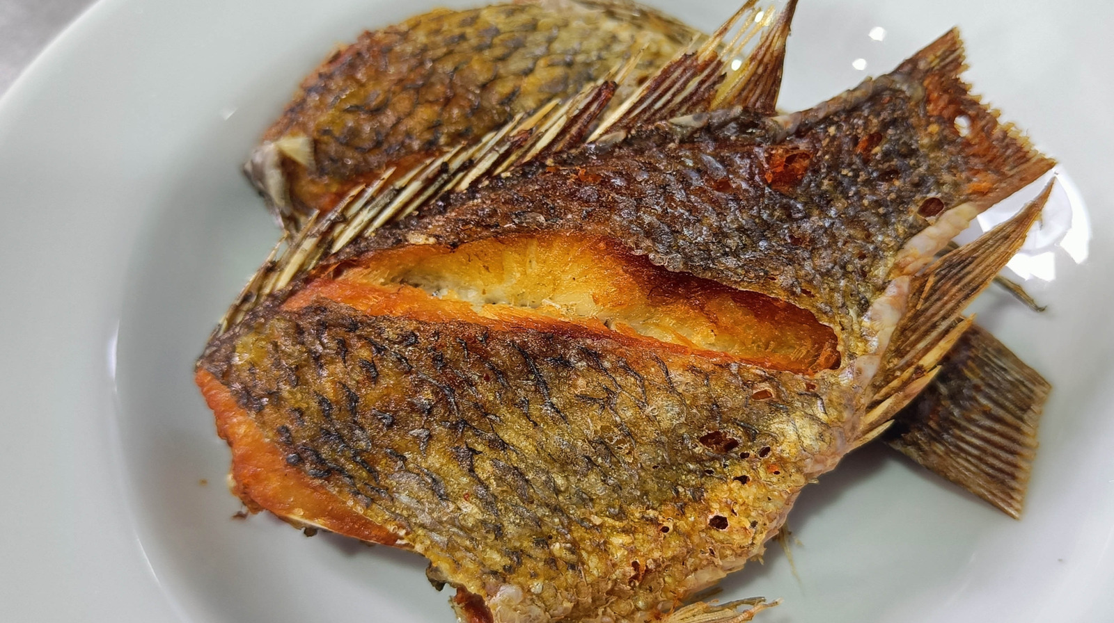 Use Parchment Paper For The Crispiest Pan Fried Fish Ever