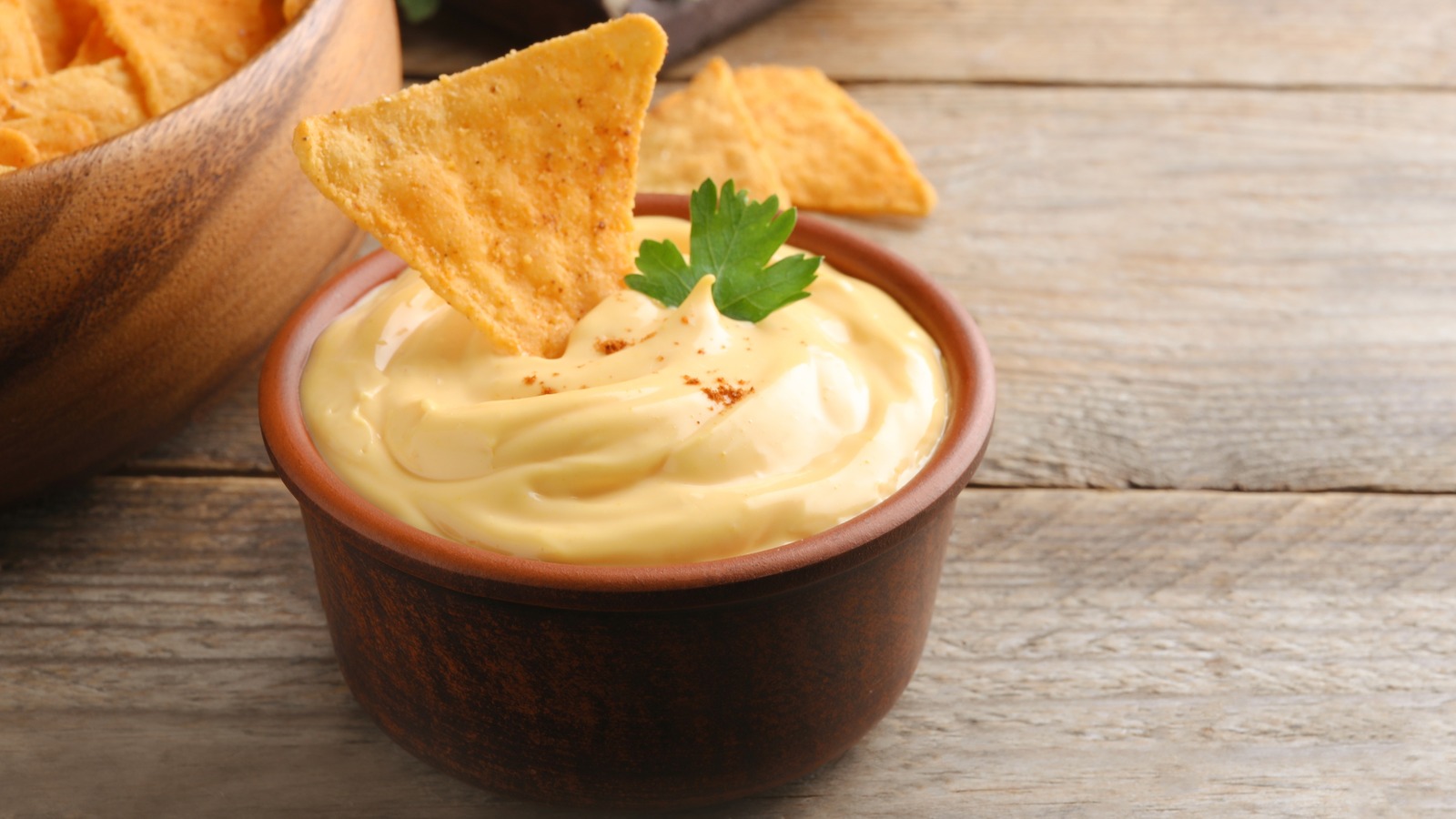 Irresistible Nacho Cheese Sauce Comes Down To One Special Ingredient