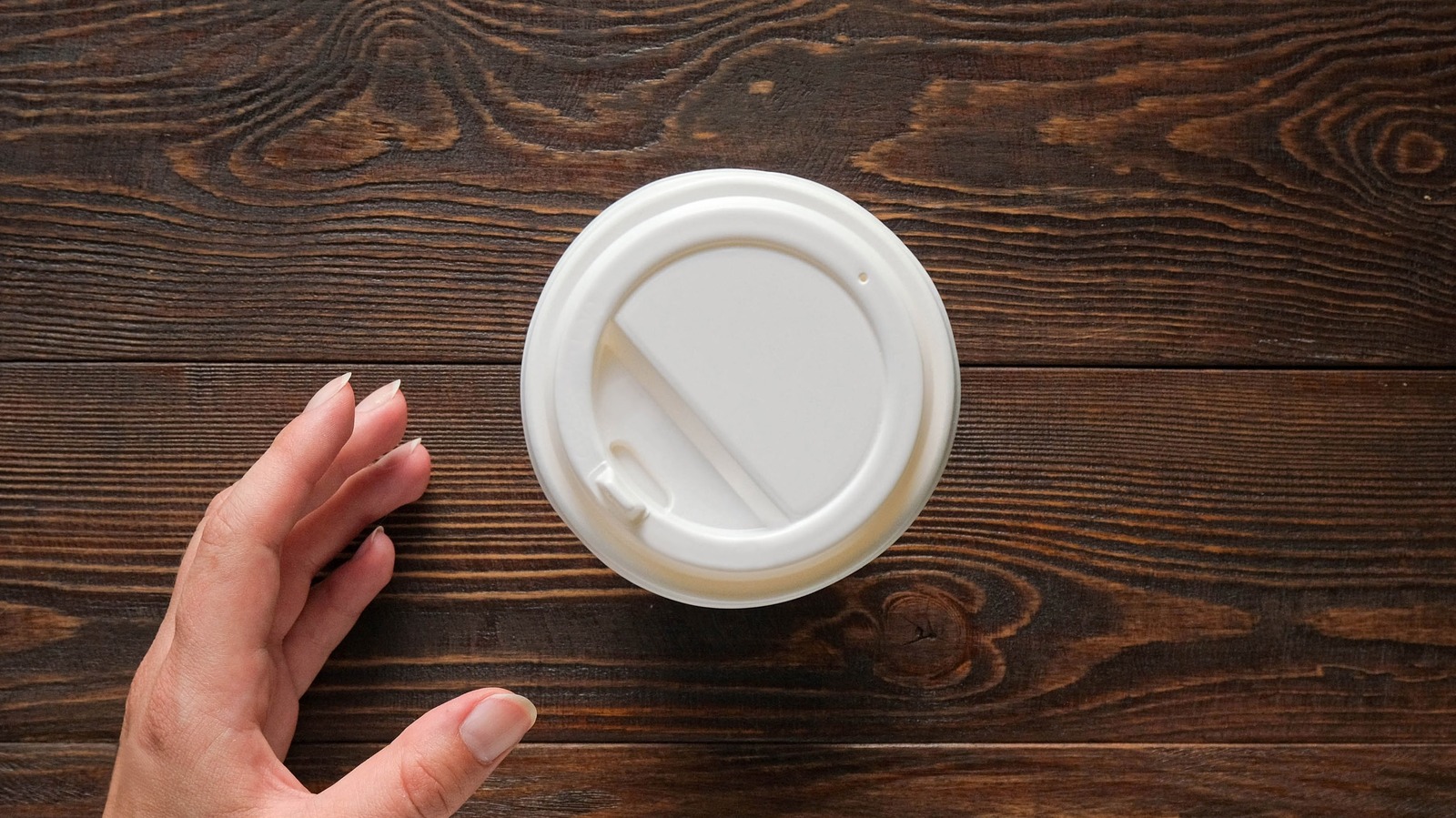 The Genius Reason There's A Tiny Hole In Your Coffee Lid