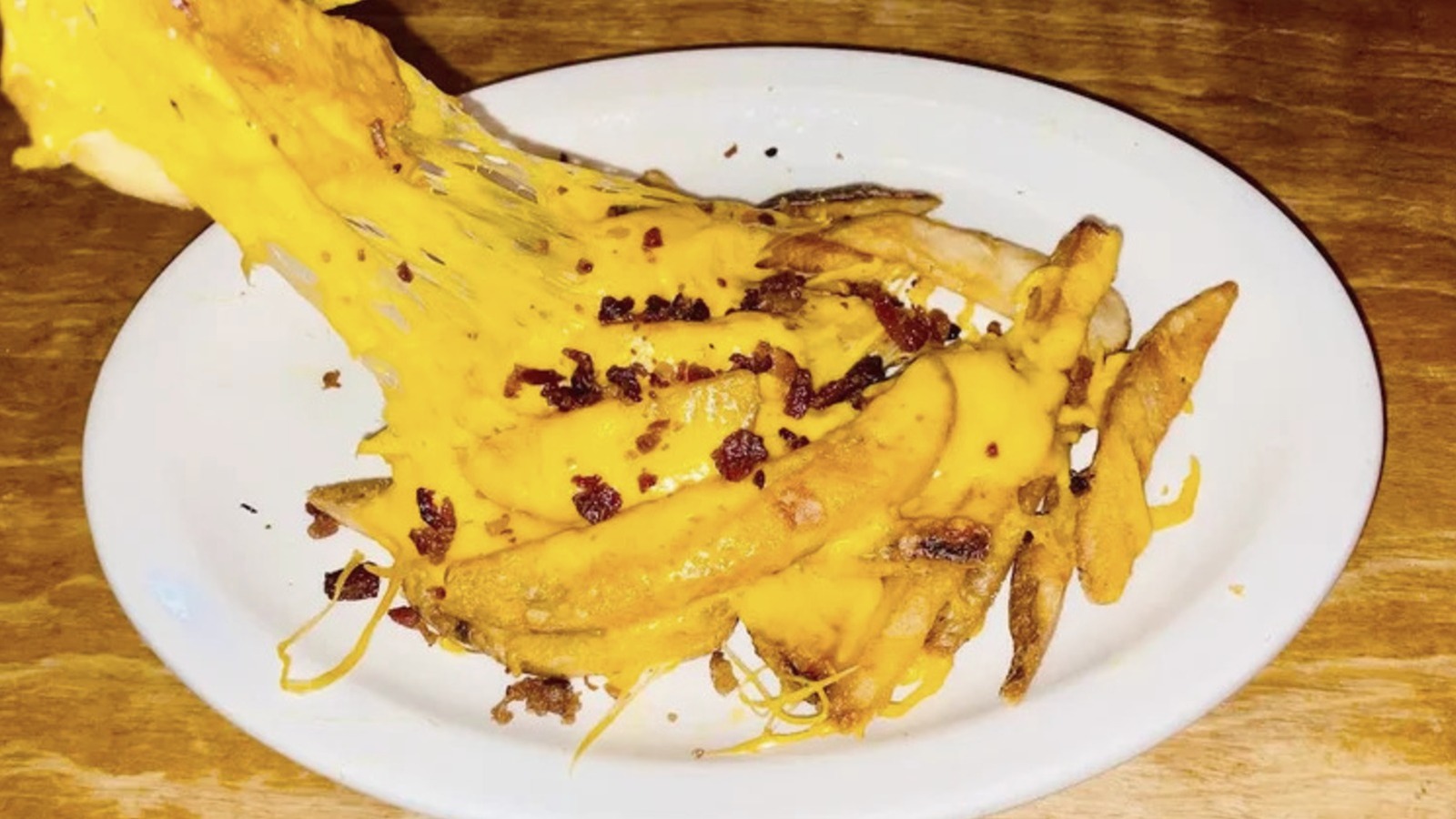 The One Detail That Makes Texas Roadhouse Cheese Fries Stand Out