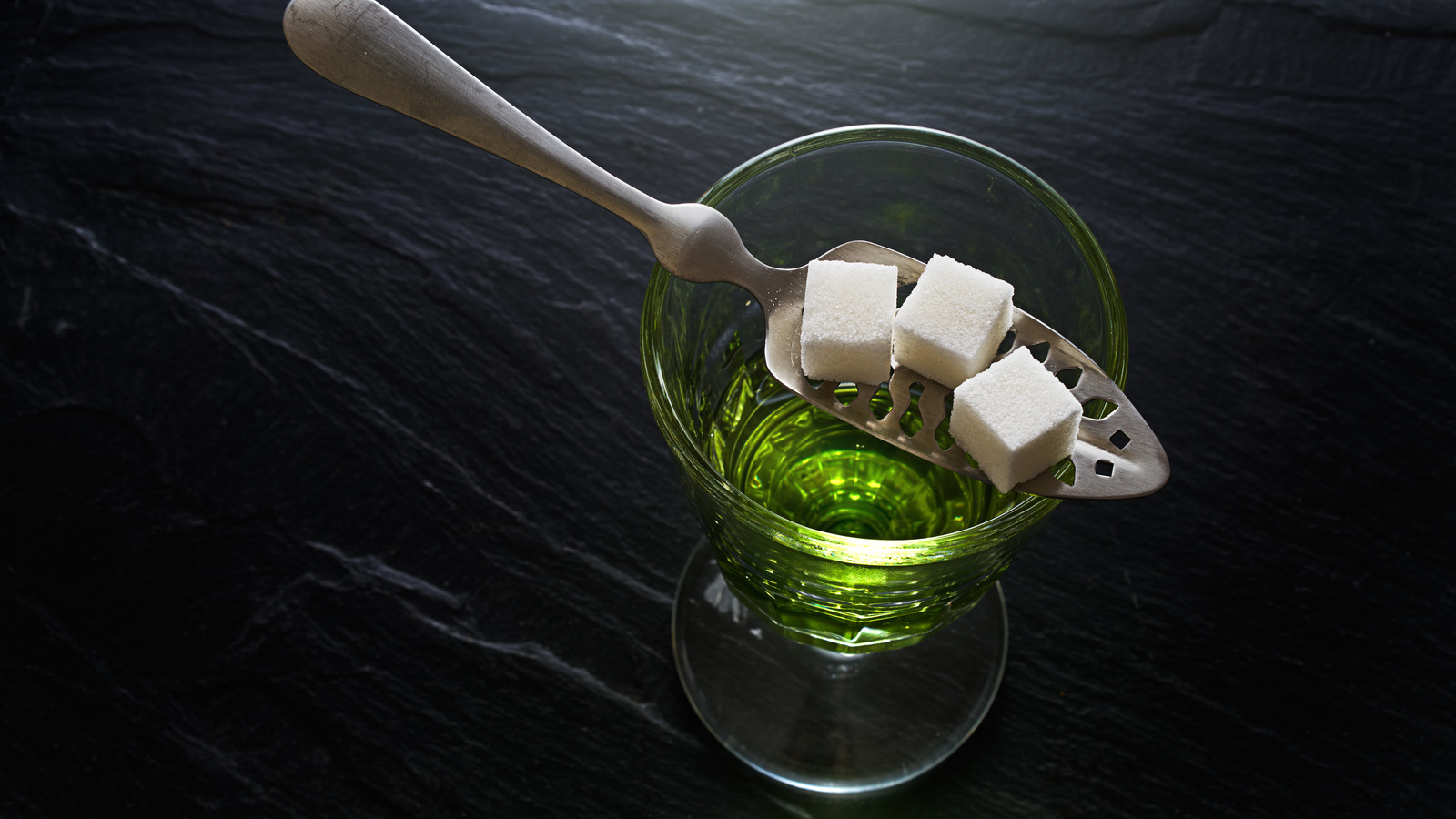 The Right Way To Drink Absinthe (And Why You Need A Slotted Spoon)