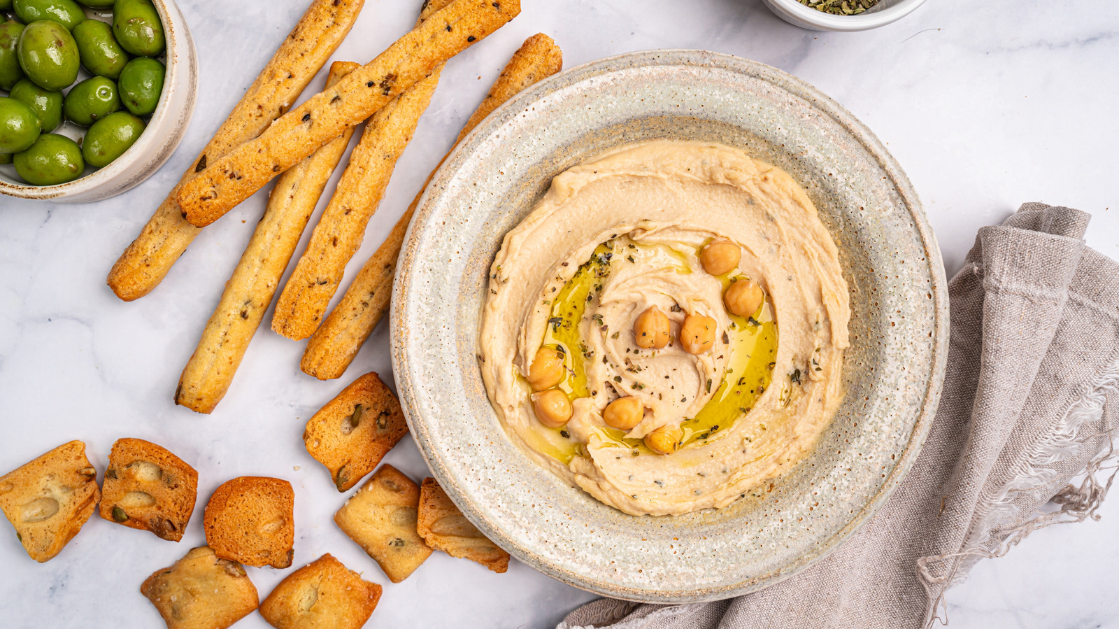 The Starchy Side Dish That Seriously Benefits From A Spoonful Of Hummus
